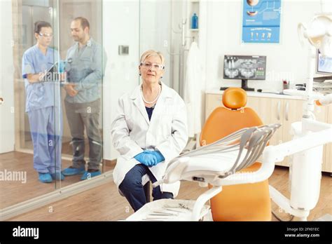 Stomatologist Senior Woman Looking Into Camera While Waiting For Sick