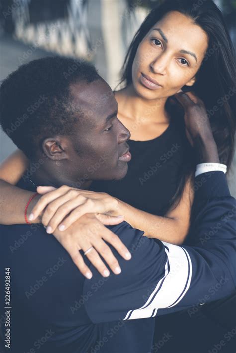 Lovely And Cool Mixed Races Couple In The Park Latino Woman And