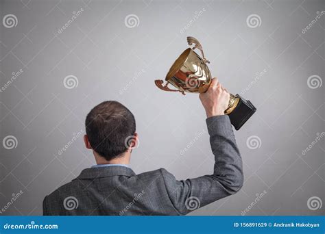 Businessman Holding Golden Trophy Business Success Stock Image