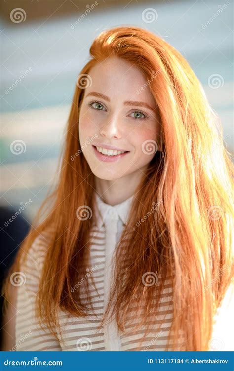 Ginger Female With Long Straight Shiny Hair And Natural Make Up Smiling