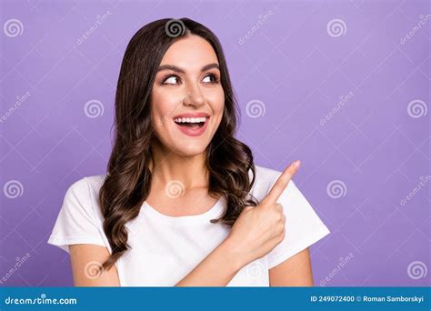 Photo Of Impressed Brunette Millennial Lady Look Point Empty Space Wear
