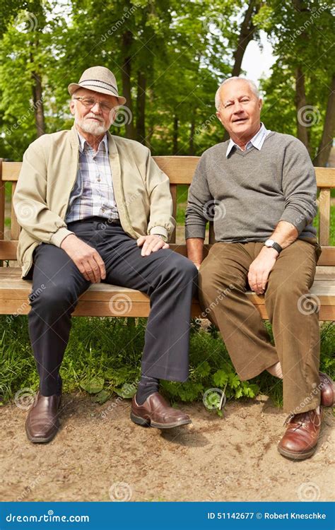 Two Senior Men Sitting On A Park Bench Stock Image Image Of Forest