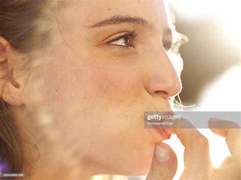 Teenage Girl Licking Finger Closeup Stock Foto Getty Images