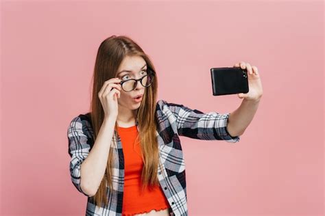 Free Photo Woman With Glasses Taking A Selfie