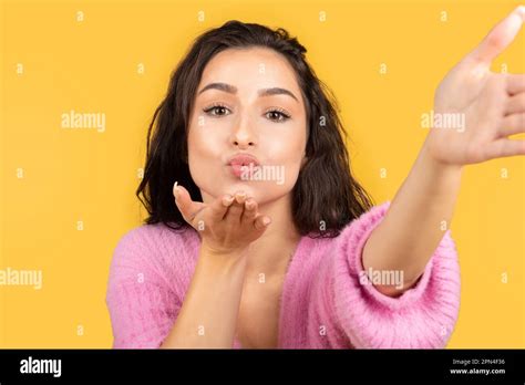 Happy Millennial Middle Eastern Woman Making Blowing Kiss Taking
