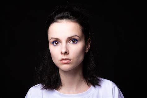 Premium Photo Beautiful Woman In White Tshirt Black Background