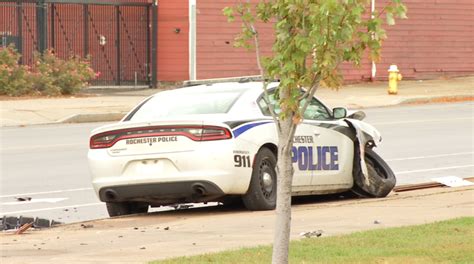 Pickup Truck Crashes Into Police Car After Running Red Light