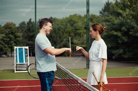 Premium Photo Cheerful Couple Giving Fist Bump With Fist Before