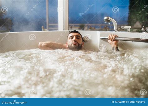 Man Relaxing At Home In The Hot Tub Bath Ritual Spa Day Moment In