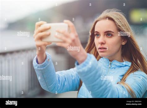 Pretty Woman Taking A Selfie Beautiful Girl Walking On The Streets And
