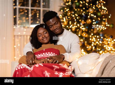 Happy Millennial Black Man Hugging Woman With Plaid Enjoy Holiday