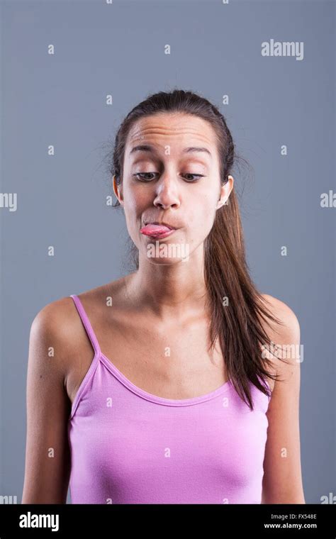 Tongue Stuck Out In A Funny Face Made By This Lovely Funny Girl Stock