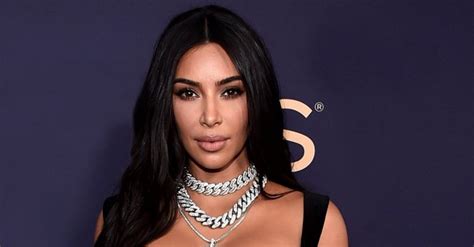 Kim Kardashian Flaunts A Long Braid And Enviable Curves Lying In A Pool