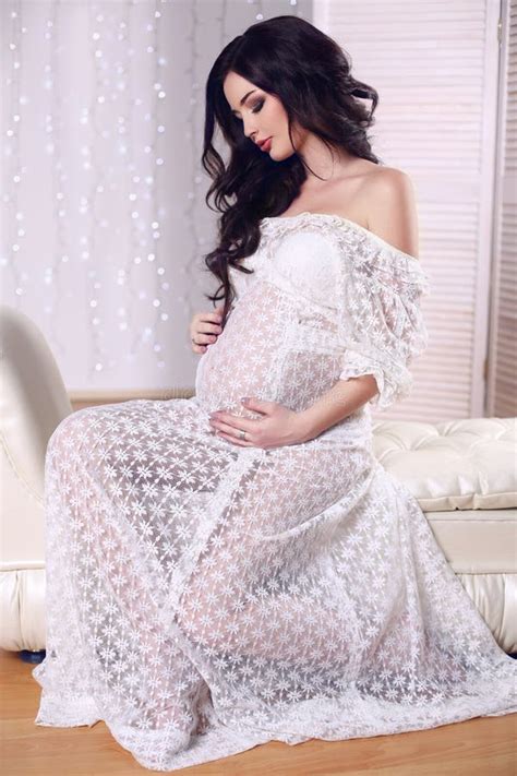 Beautiful Pregnant Woman With Dark Hair Wearing Lace Dress Stock Image