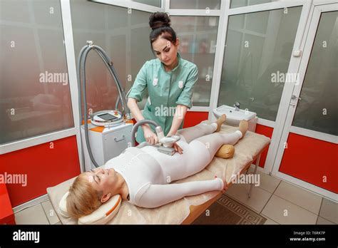 Woman Having Anti Cellulite Lpg Massage Treatment With Apparatus In