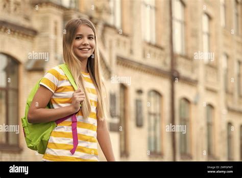 Happy Teen Girl Smiling Standing At School Blurry Outdoors Copy Space
