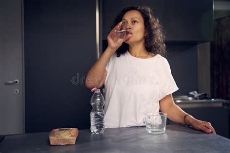 Beautiful Multi Ethnic Curly Haired Young Adult Woman In White Pajamas