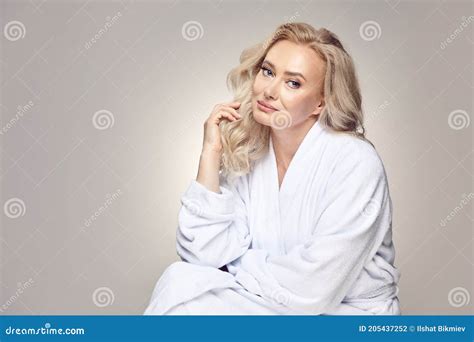 Caucasian Mature Blonde Woman With A Clean A Healthy Skin Wearing In