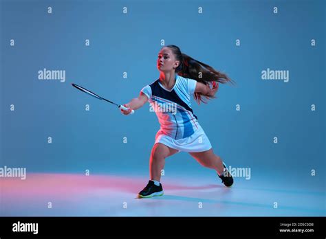 Motion Beautiful Dwarf Woman Practicing In Badminton Isolated On Blue