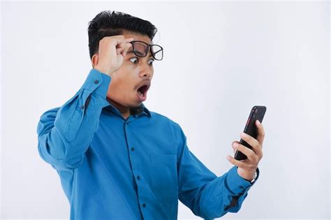 Premium Photo Surprised And Shocked Handsome Young Asian Businessman