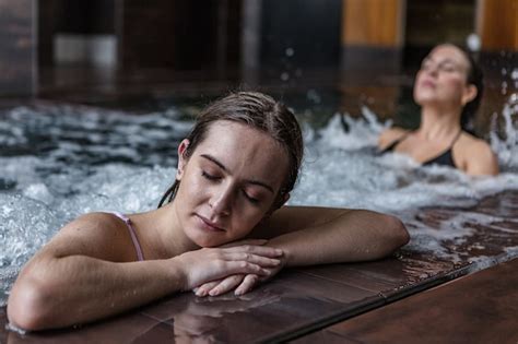 Premium Photo Relaxed Woman Getting Hydro Massage Therapy In Pool
