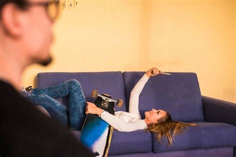 Premium Photo Woman Taking Selfie While Lying On Sofa At Home