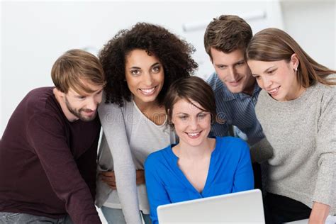 Happy Diverse Office Workers Team Laughing Together At Group Meeting