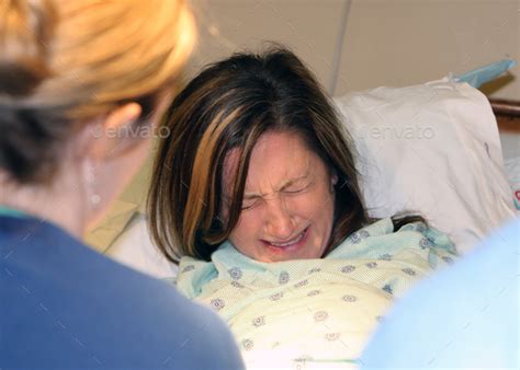 Pregnant Woman In Active Labor Begins Pushing During Contractions