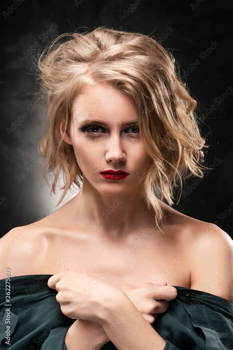Beautiful Young Braless Slim Blonde Girl With Disheveled Hair And