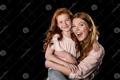 Redhead Mother And Daughter Having Fun Together Isolated On Black Stock