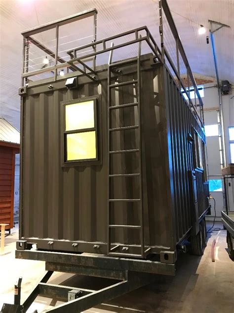 shipping container based tiny house can be towed or stowed