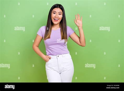 Photo Of Attractive Vietnamese Chinese Young Woman Waving Hand Say