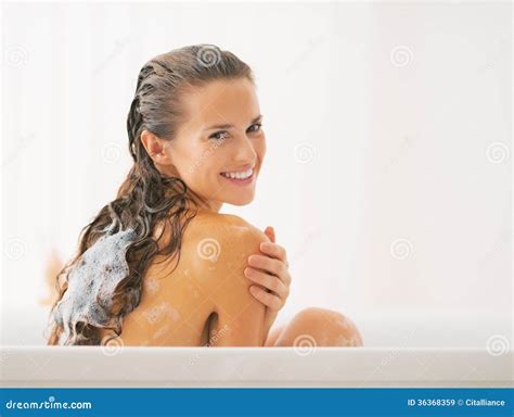 Smiling Young Woman Washing Hair In Bathtub Stock Image Image Of