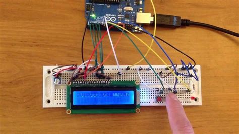arduino project scrolling text on 16x2 lcd controlled by pushbuttons