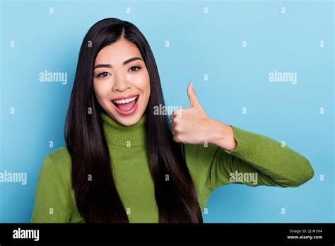 Photo Of Hooray Millennial Brunette Lady Thumb Up Wear Green Pullover