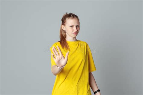 Photo Of Serious Teen Girl Showing Stop Gesture Isolated On Light Grey