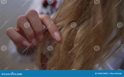 Slim Female Hand Touching Brown Hair In Slow Motion Unrecognizable