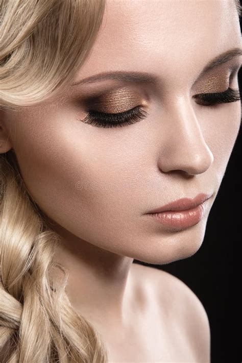 Beautiful Blonde In A Hollywood Manner With Curls Natural Makeup And