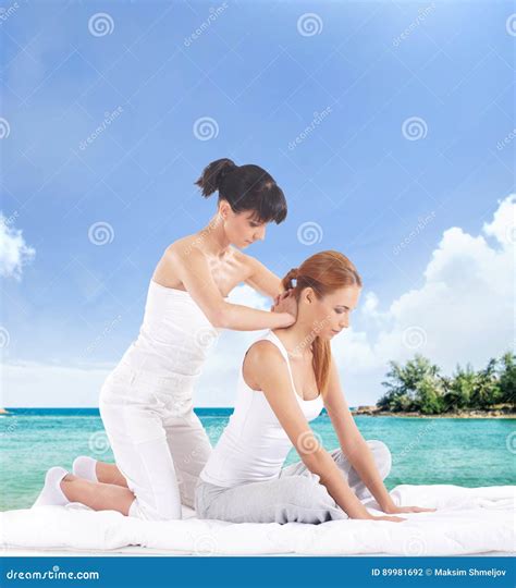 Young Woman Getting Traditional Thai Stretching Massage By Therapist