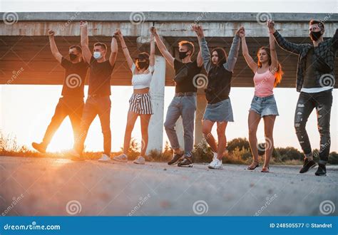 Embracing Each Other Group Of Young Cheerful Friends Having Fun