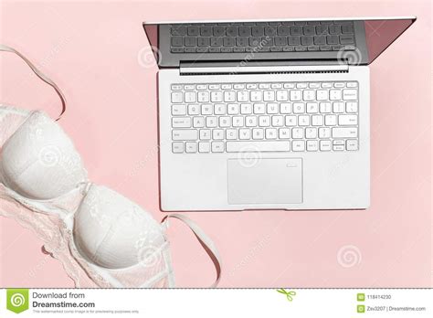 Erotic Chat Virtual Sex Concept White Bra Thrown On A Modern Laptop