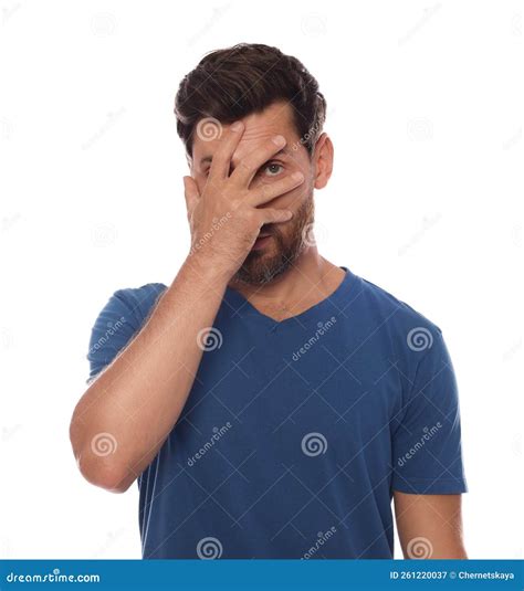 Embarrassed Man Covering Face With Hand On White Background Stock Image