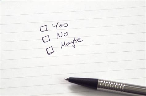 checkboxes for yes no maybe in handwriting on lined paper with pen
