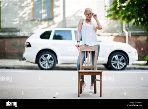 Stylish Blonde Woman Wear At Jeans Glasses Choker And White Shirt