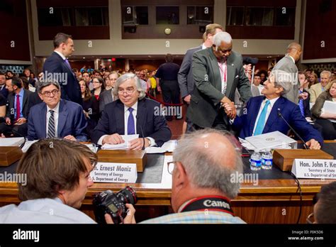 Senate Staffer Greets Secretary Kerry Before Testifying About Iranian