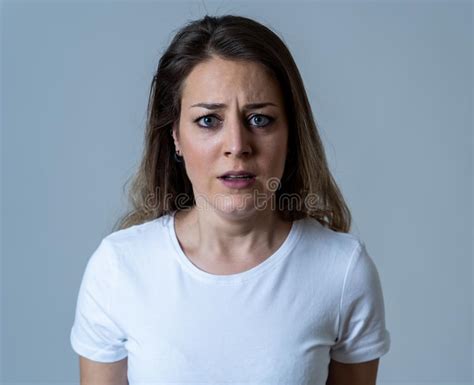 Portrait Of A Young Attractive Woman Looking Scared And Shocked Human