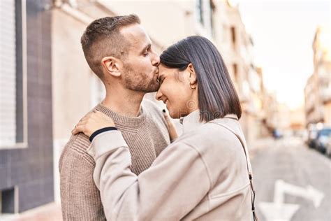 Man And Woman Couple Smiling Confident Hugging Each Other Kissing At
