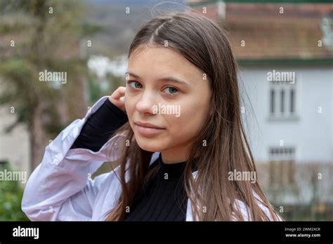 Street Portrait Of A Beautiful Teenage Girl 12 Years Old Fixing Her