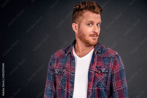 Headshot Of Intrigued Good Looking Ginger Male With Bristle In Blue
