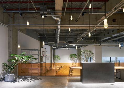 concrete and scaffolding wood define areas at akqa s offices